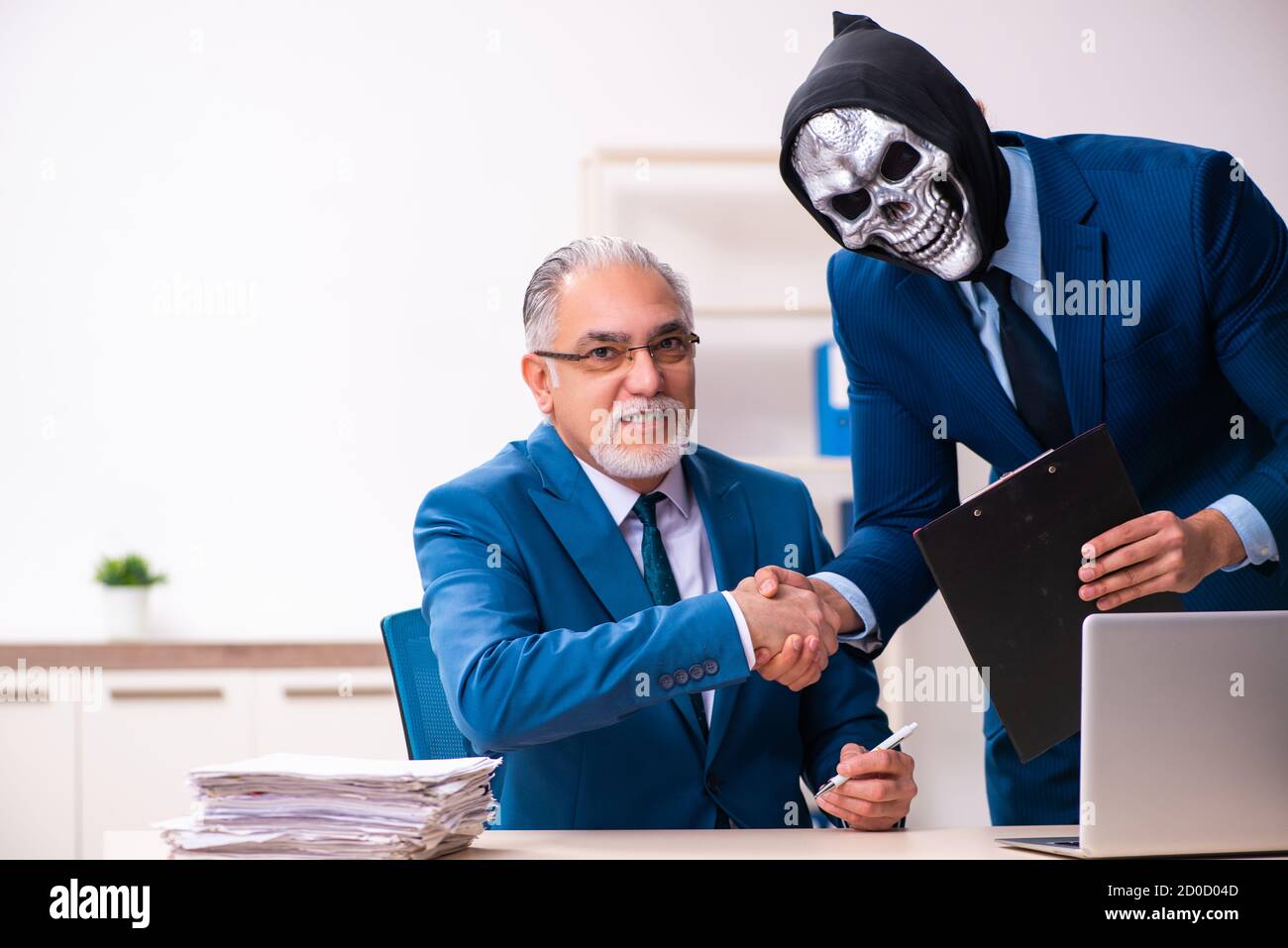 Old businessman employee making deal with the devil Stock Photo - Alamy