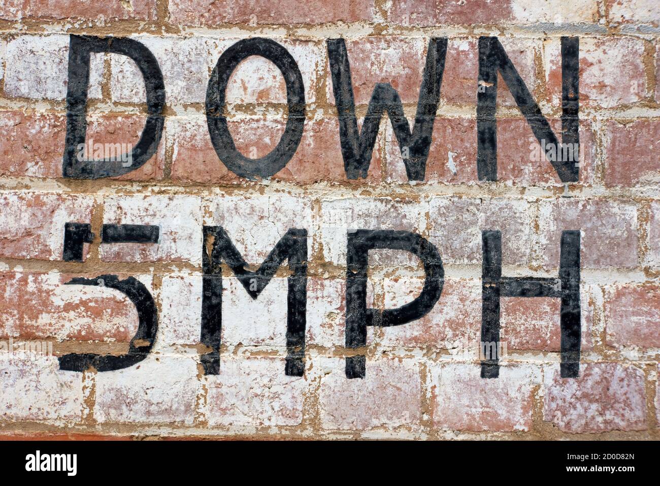 Old brick wall texture with black graphic lettering and abstract ...