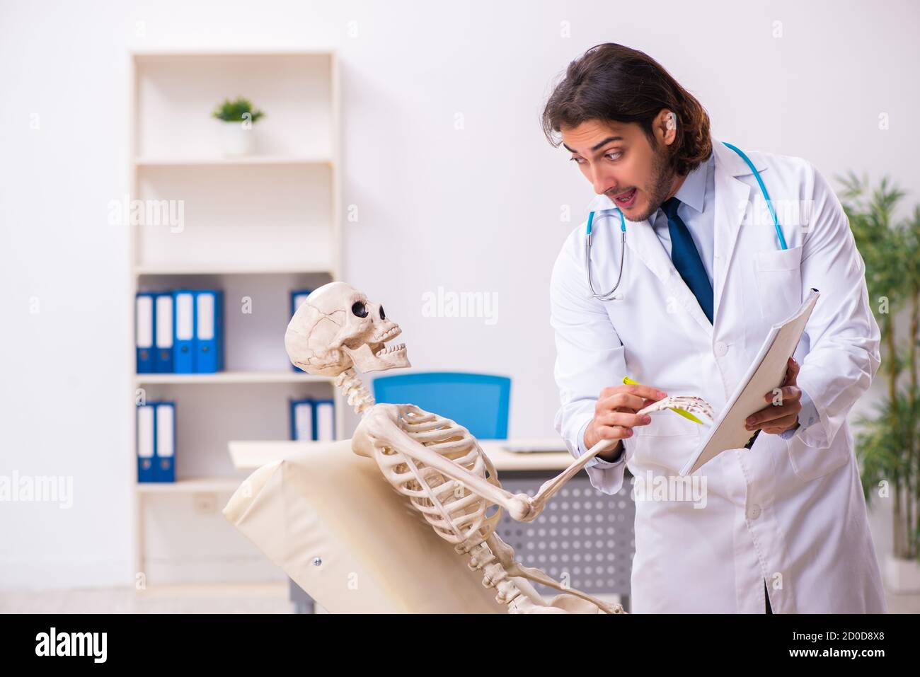Crazy doctor examining the dead patient Stock Photo - Alamy