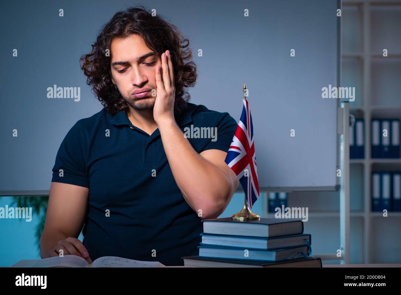 Young student in the classroom at night Stock Photo - Alamy