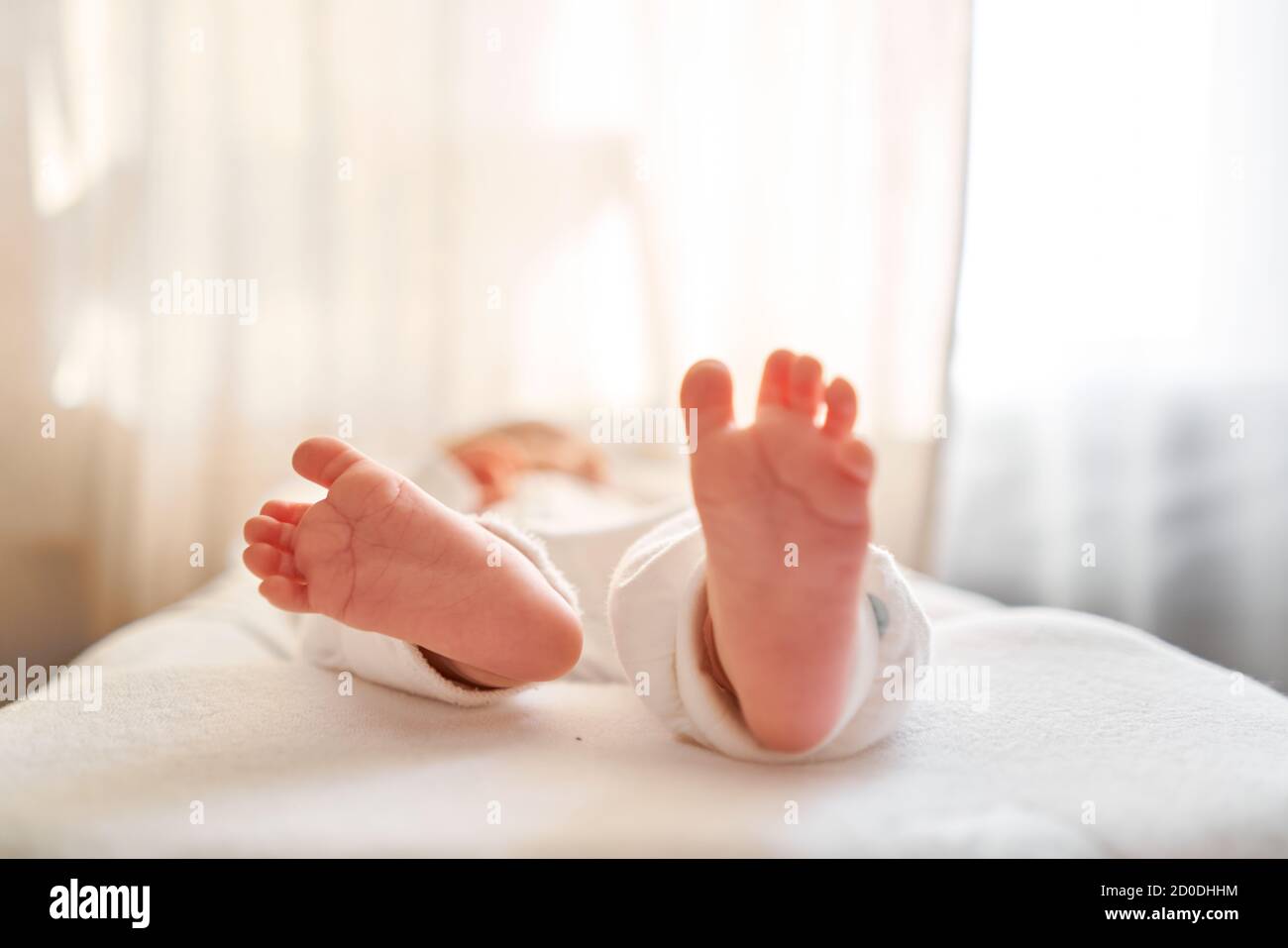 Feet of newborn baby. Baby little feet in parents hand. Feet skin care ...