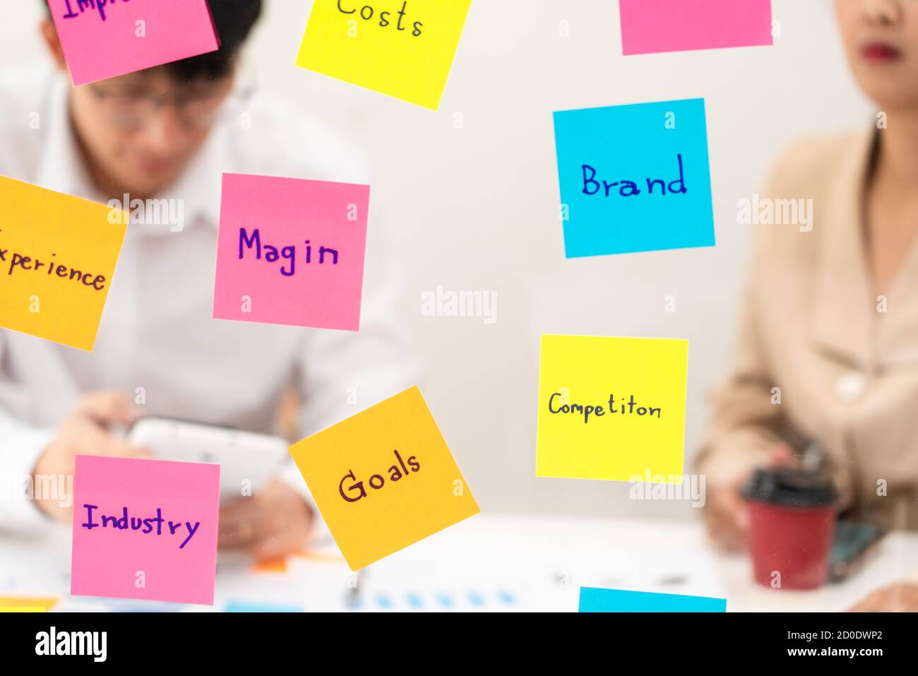 Creative group of business people brainstorming use sticky notes to ...