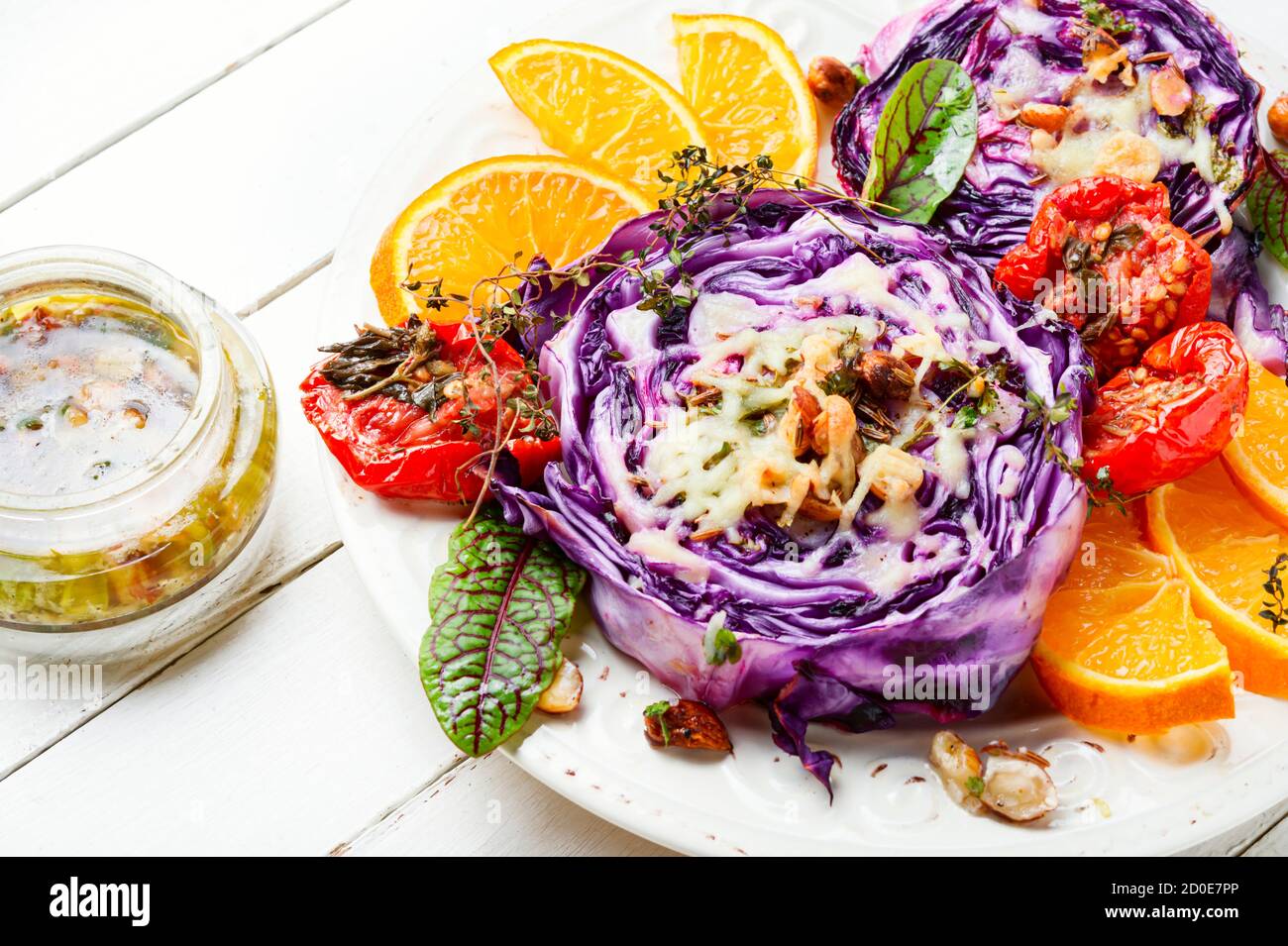 Vegetable steak from red cabbage baked with orange and hazelnuts Stock ...