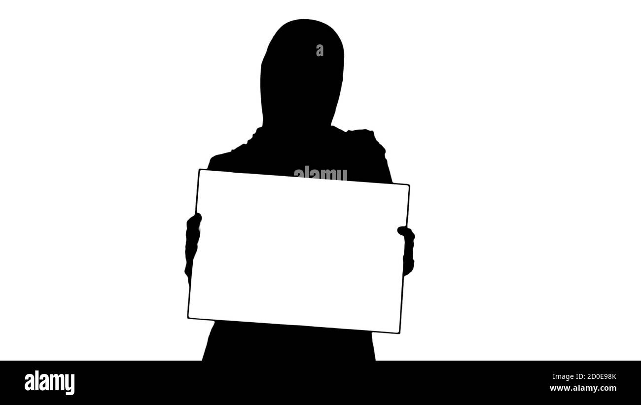 Silhouette Smiling Arab woman in hijab holding blank blue poster Stock ...