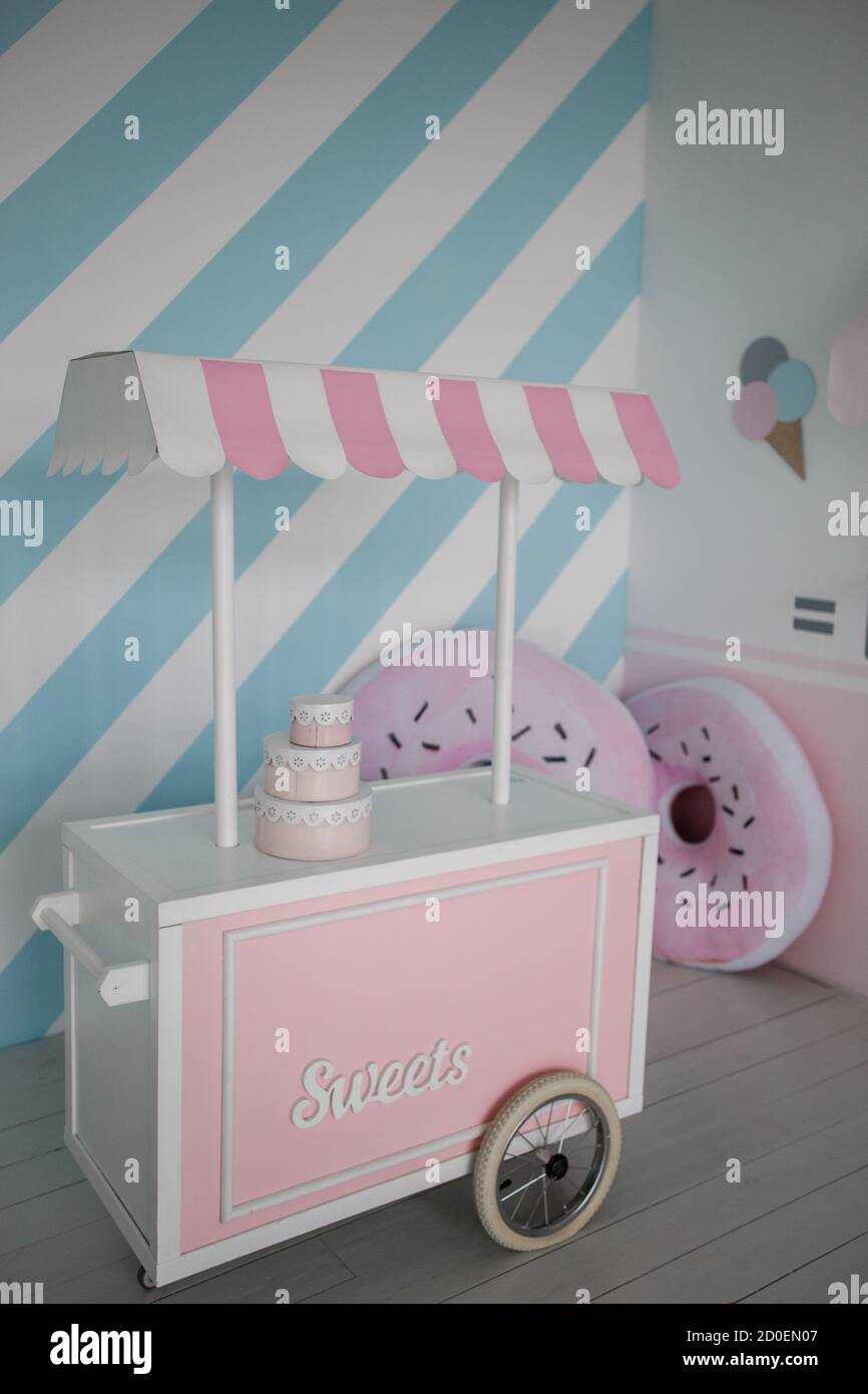 a trolley with sweets and donuts on wheels Stock Photo - Alamy