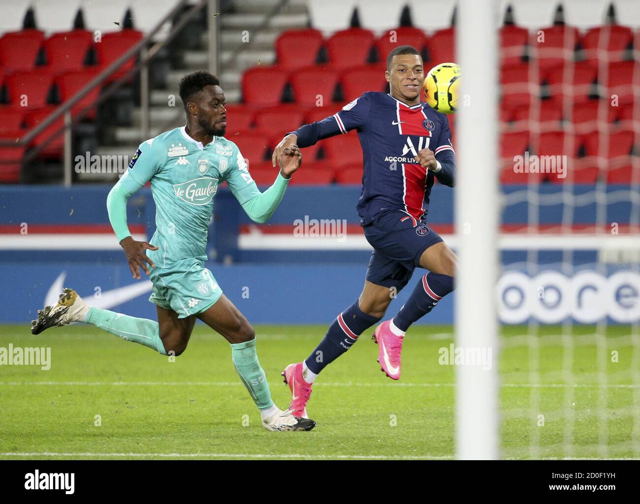 Kylian Mbappe of PSG, Abdoulaye Bamba of Angers (left) during the ...