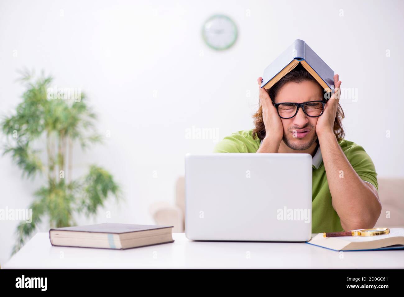Young student preparing for exams at home Stock Photo - Alamy