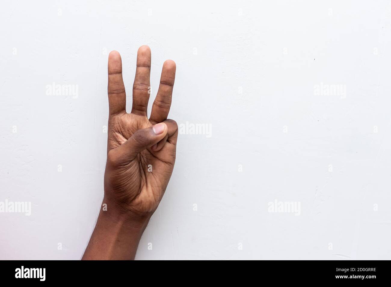 Boy hand showing number three gesture symbol isolated on white ...
