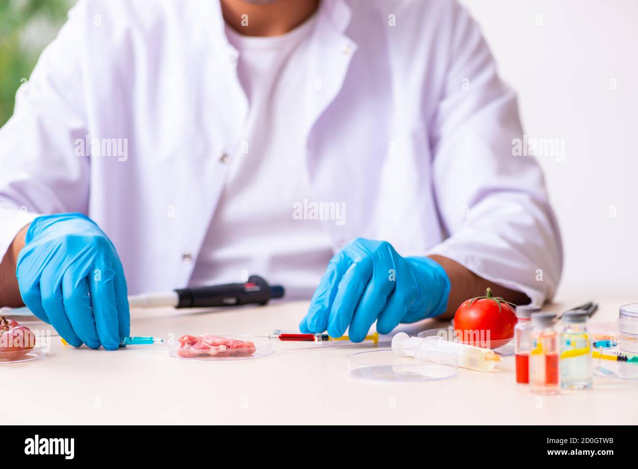 Young nutrition expert testing food products in lab Stock Photo - Alamy