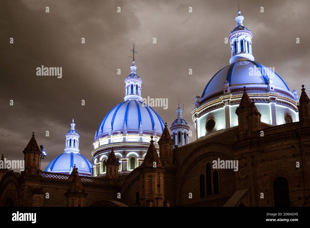 Famous domes of the New Cathedral in Cuenca, Ecuador rise over the city ...