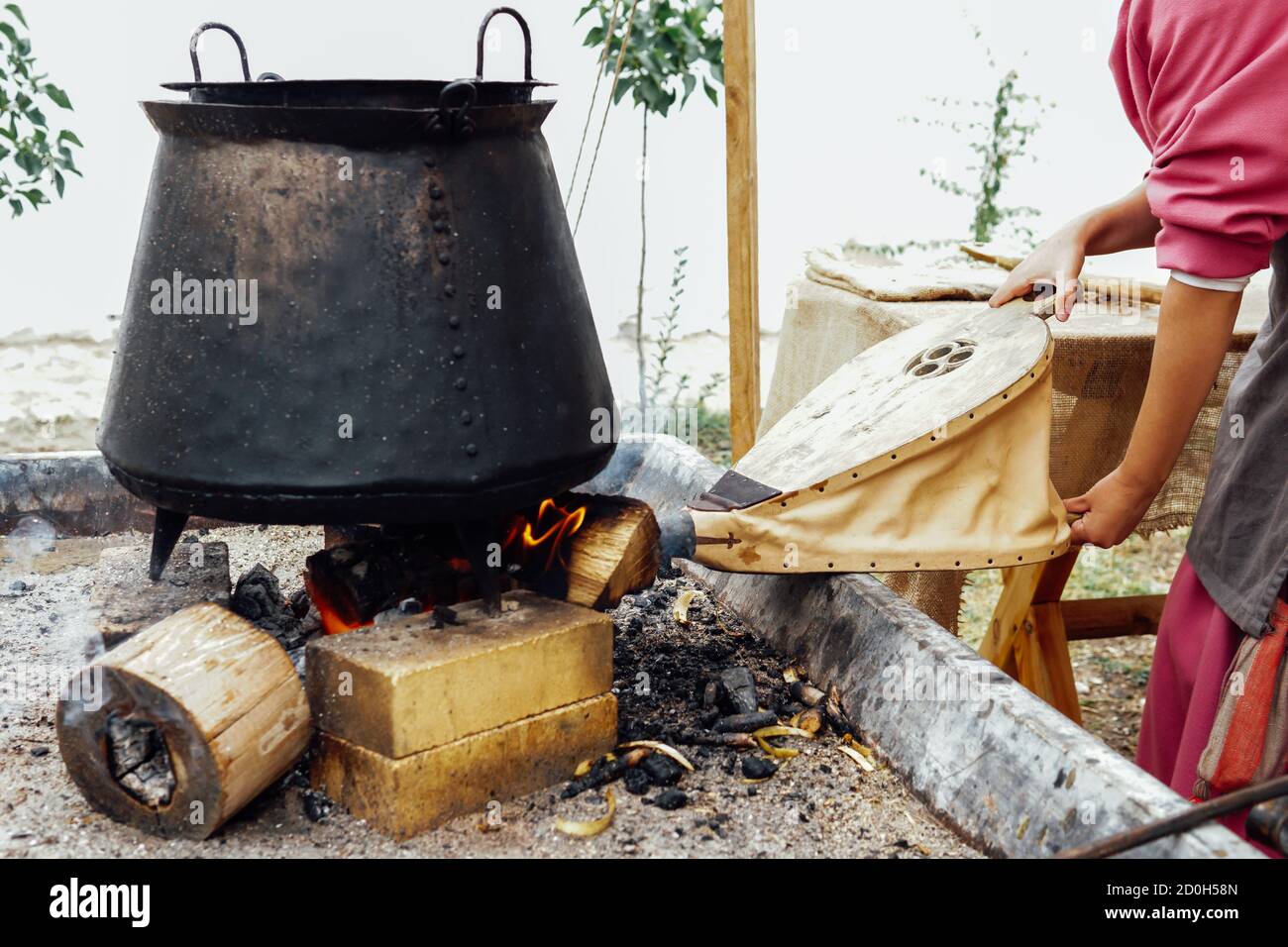 cooking delicious food in a campfire on a fire Stock Photo - Alamy