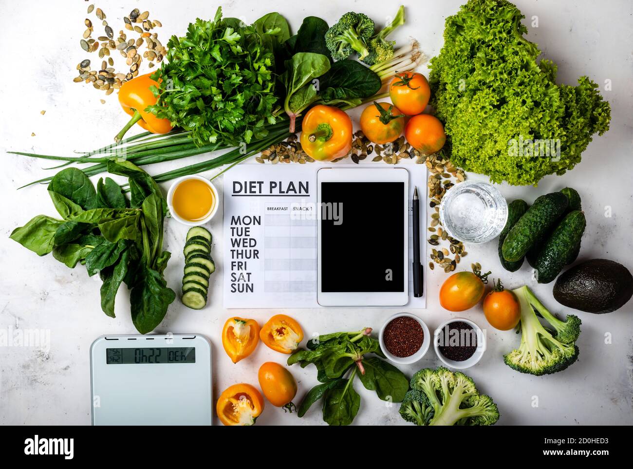Tablet computer Diet plan and set of healthy food with kitchen scale ...