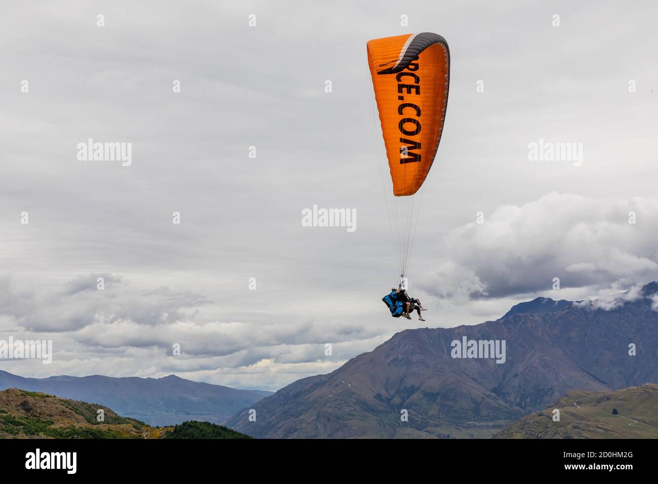 Queenstown, New Zealand: Paragliding tandems on their way from the ...