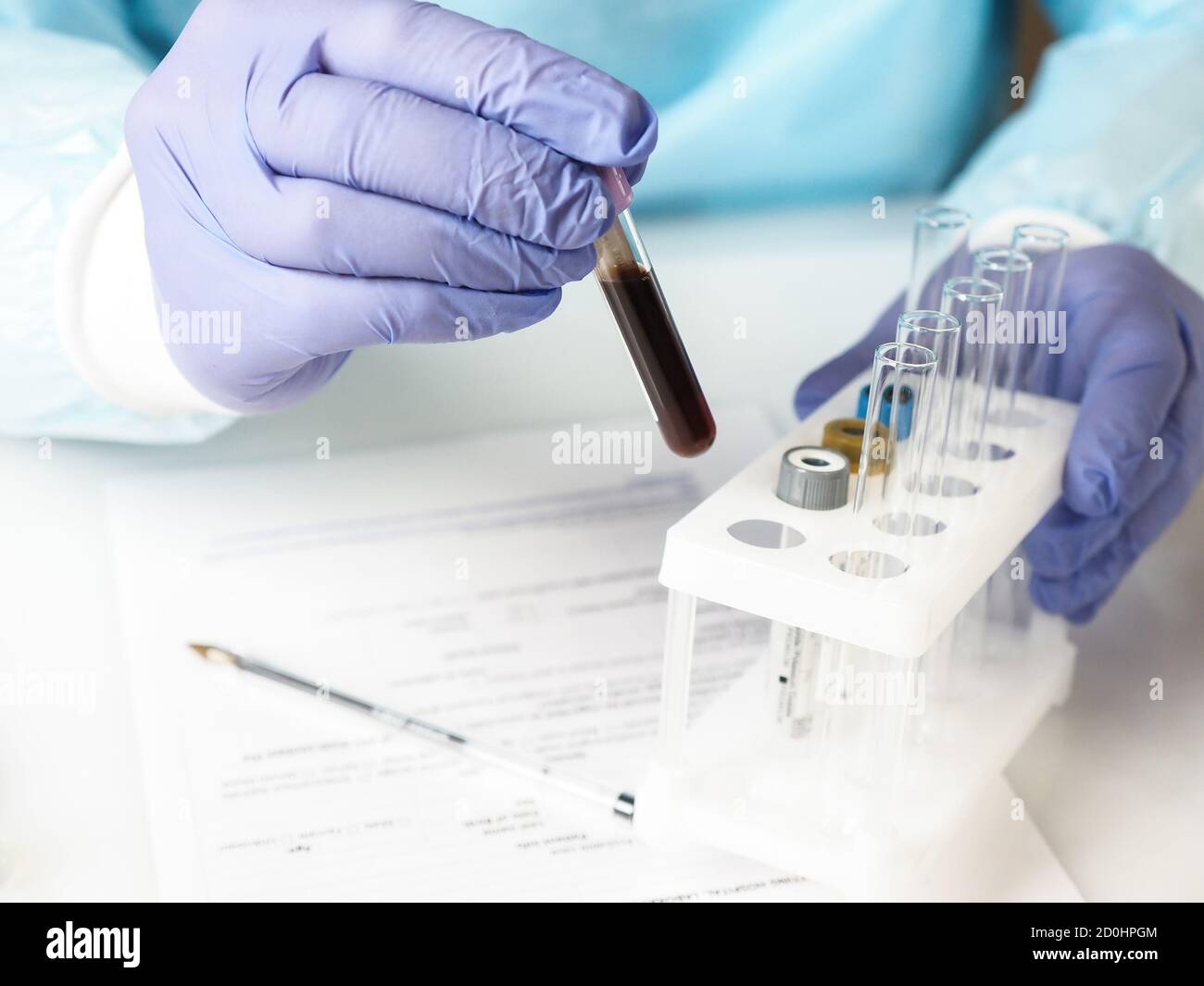 Doctor holds test tube hi-res stock photography and images - Alamy