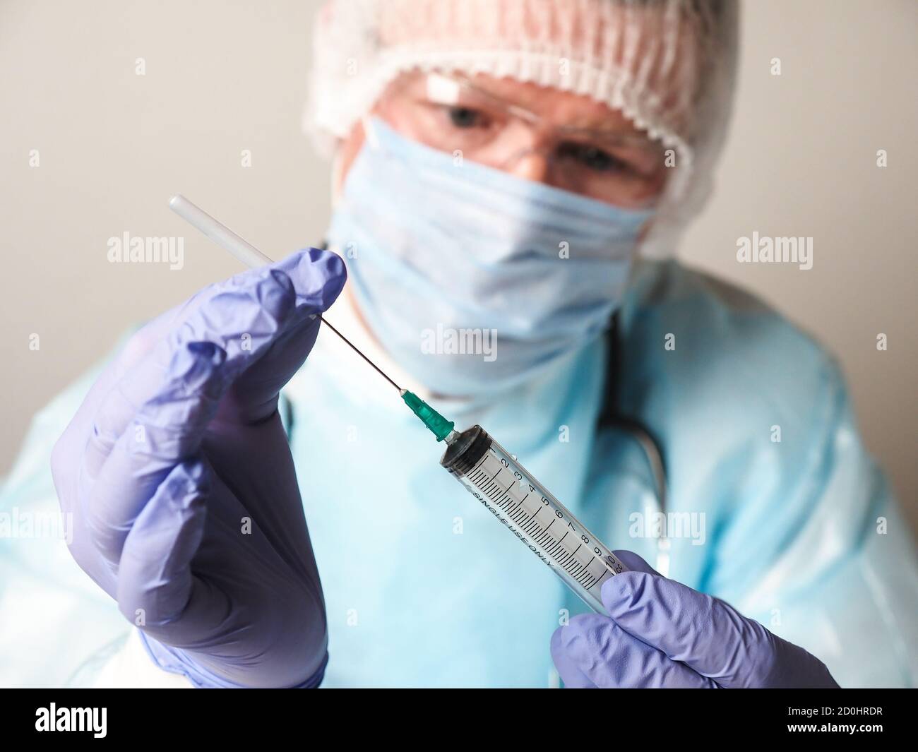 Doctor wearing protective gear hi-res stock photography and images - Alamy
