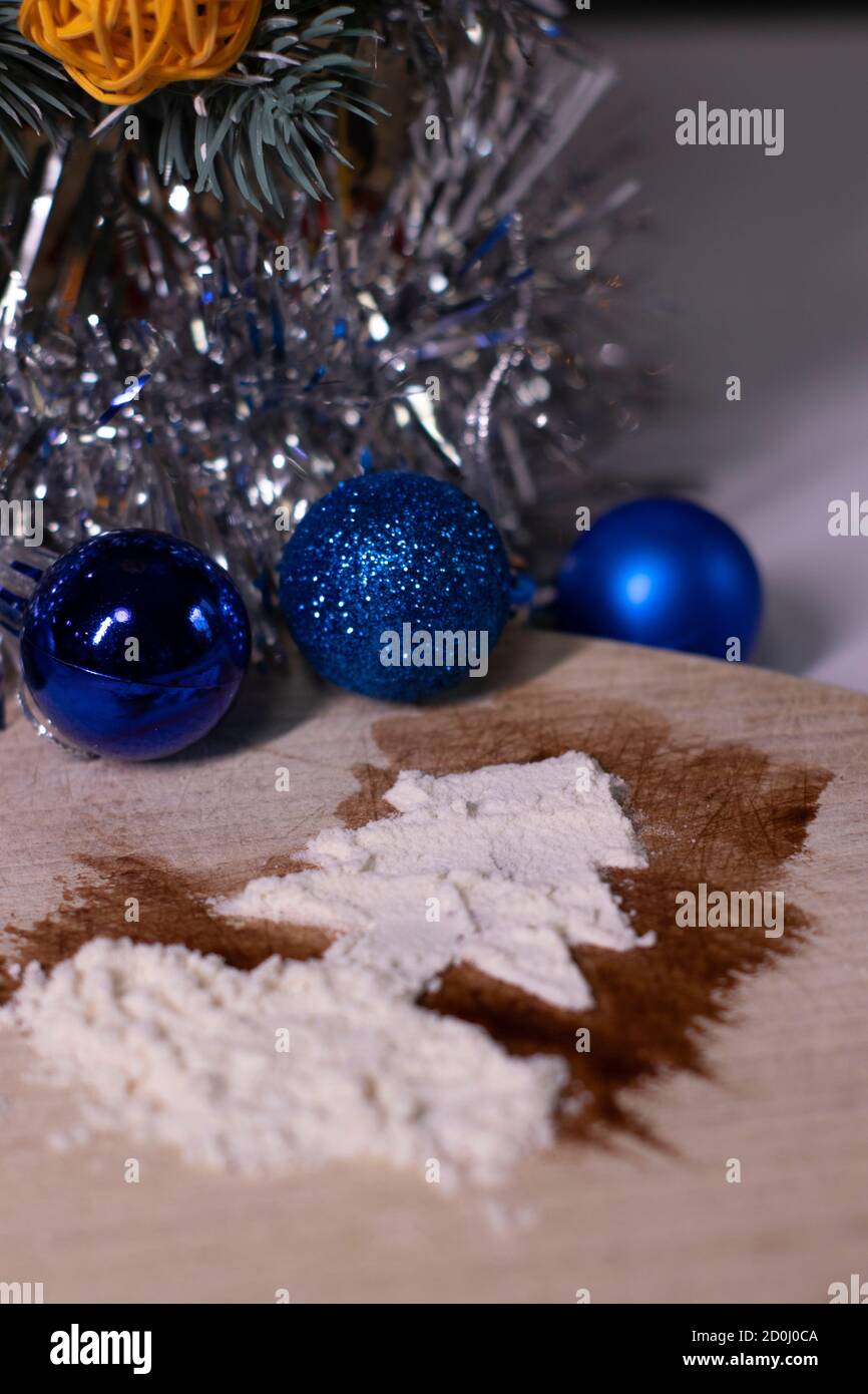 christmas tree made of snow on a wooden board next to new years ...