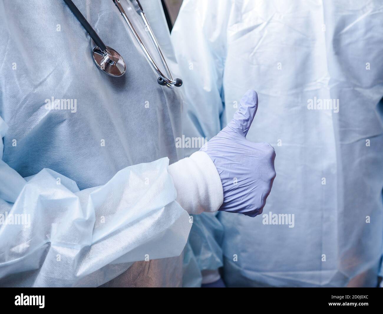 Doctors showing thumbs up indicating progress or success Stock Photo ...