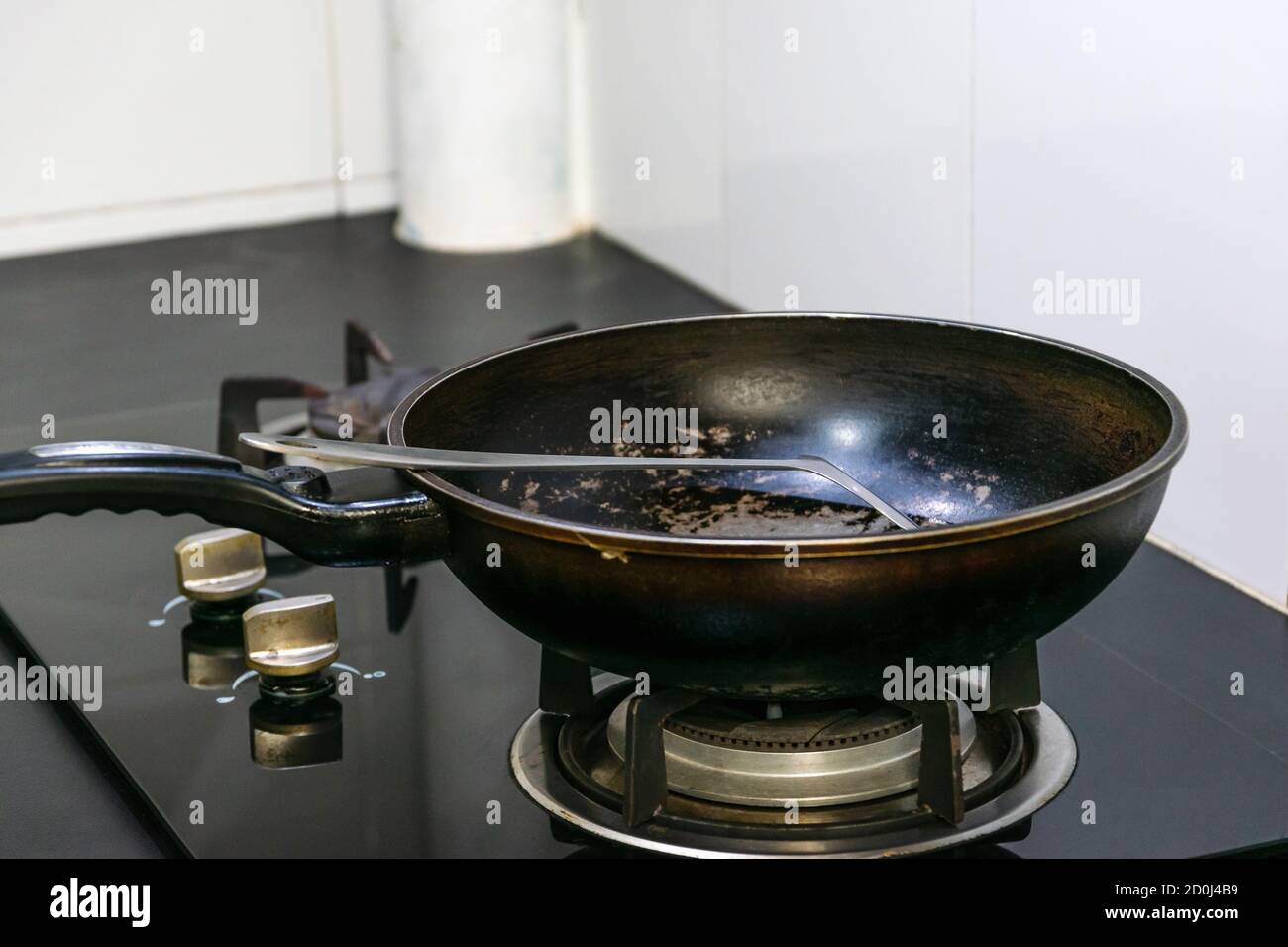 Put the pan on the gas stove, prepare for cooking in the kitchen Stock ...