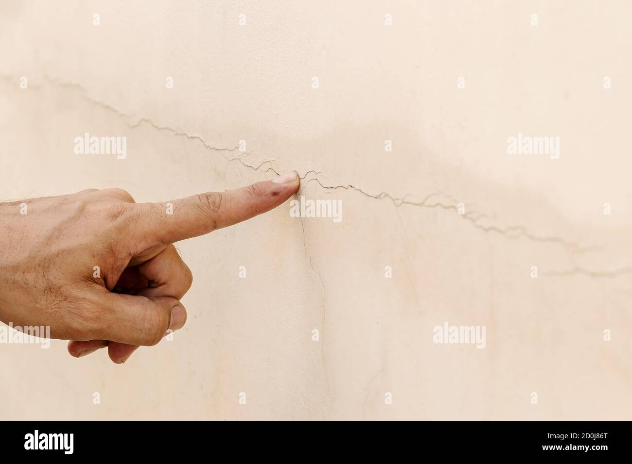 Hand crack wall hi-res stock photography and images - Alamy