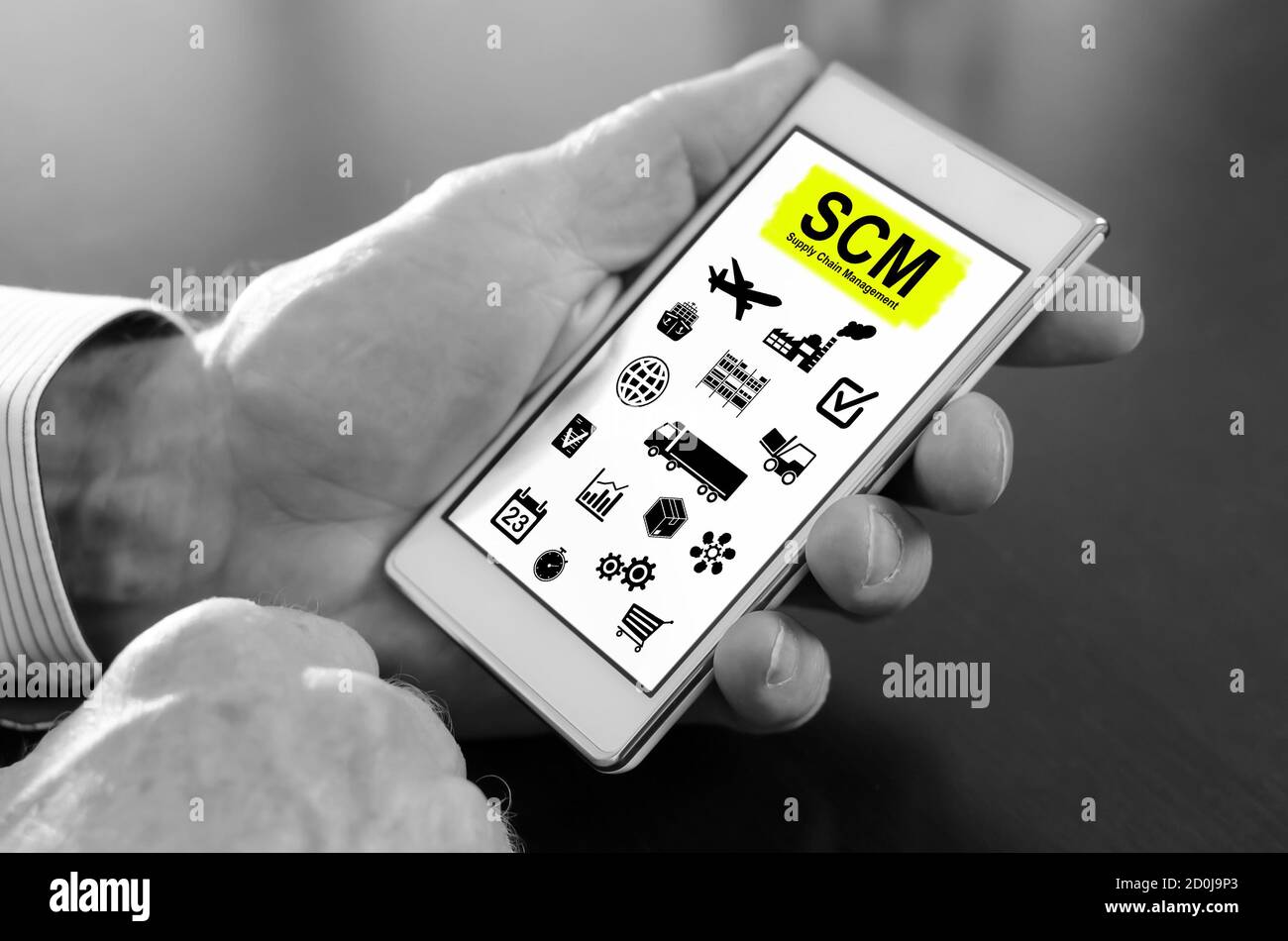 Hand holding a smartphone with scm concept Stock Photo - Alamy