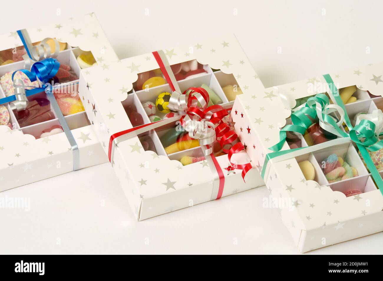 Mixed sweet boxes on white background Stock Photo - Alamy