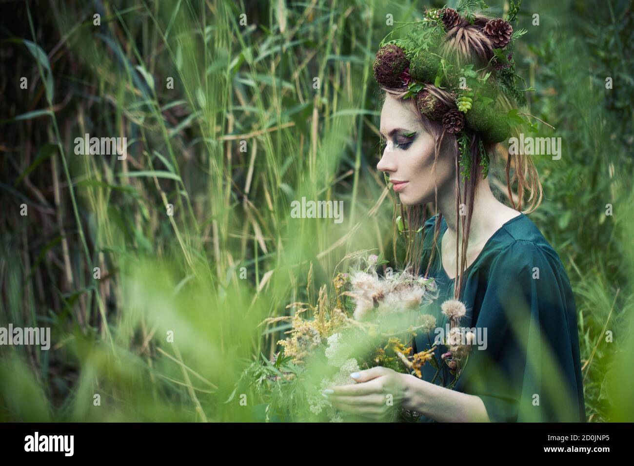 Beautiful woman earth nymph on green grass background outdoor Stock ...