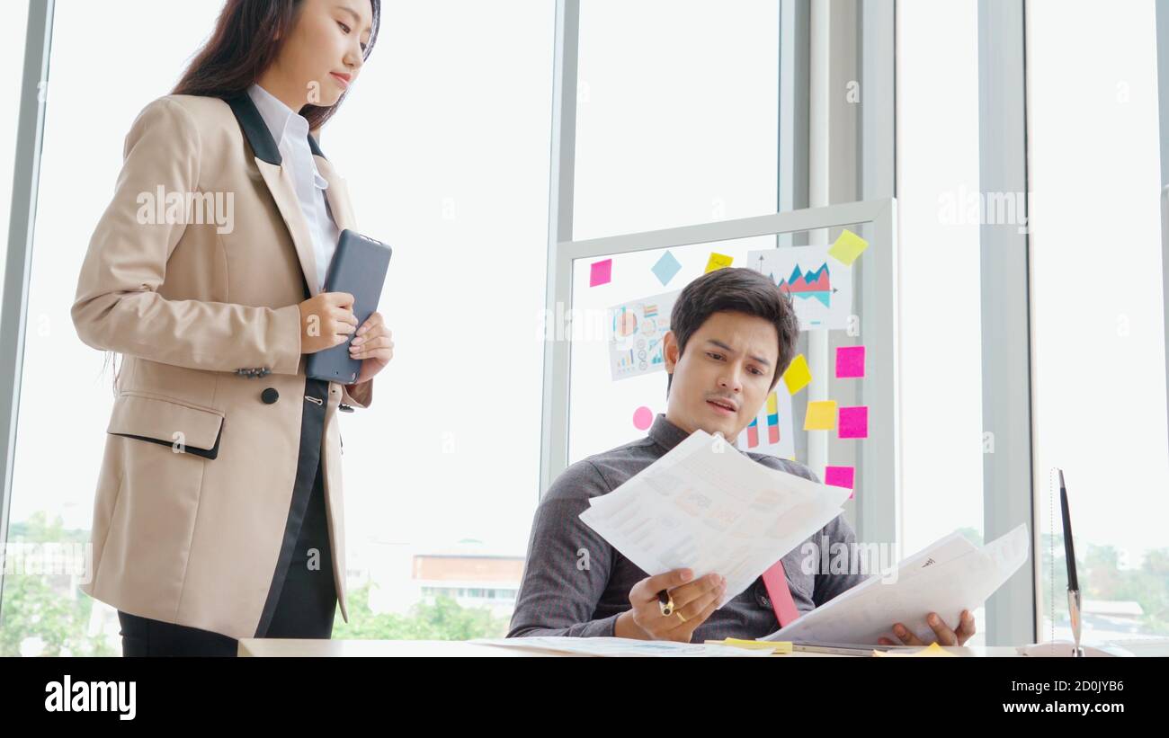 Unhappy business people dispute work problem at office . Business ...