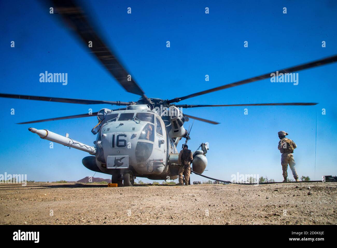A U.S. Marine Corps bulk fuel specialist (right), with Marine Wing ...