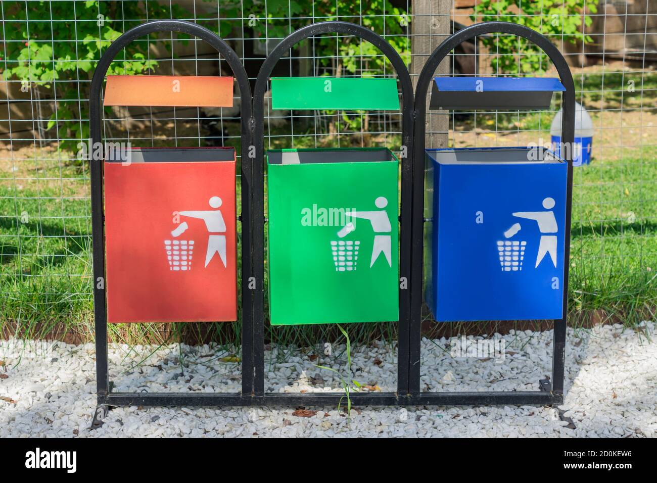 Colorful trash bins for sorting garbage in the park. Waste separate ... Colorful trash bins for sorting garbage in the park. Waste separate ...
