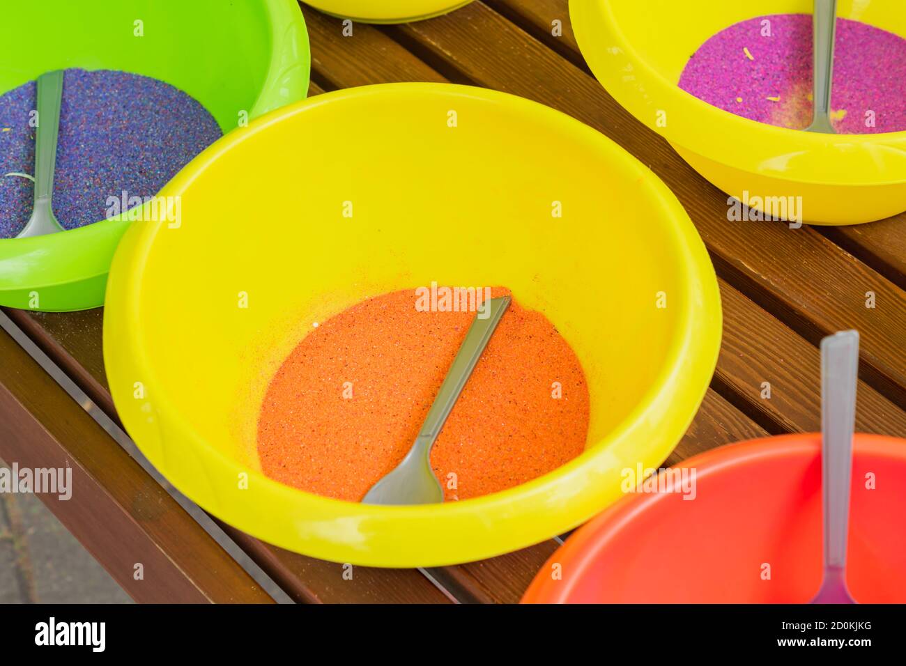 colored sand in plastic bowls. Workshop for making sand pictures for ...