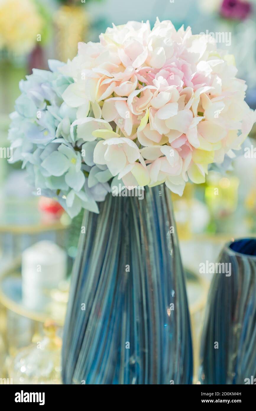 close up of blue glossy vase with hydrangea flovers. Interior ...