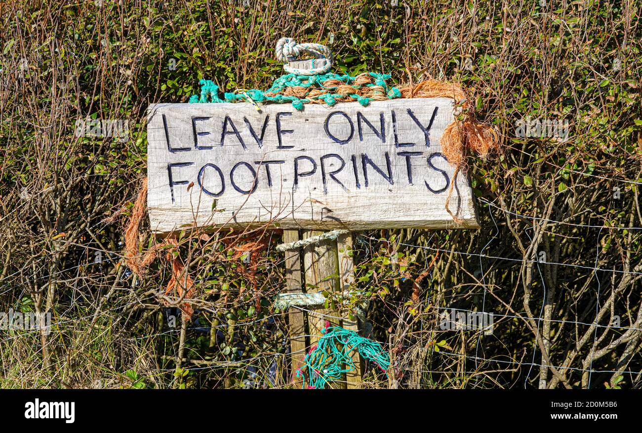 Old Wooden Beach sign enviromental message Leave only Footprints Stock ...