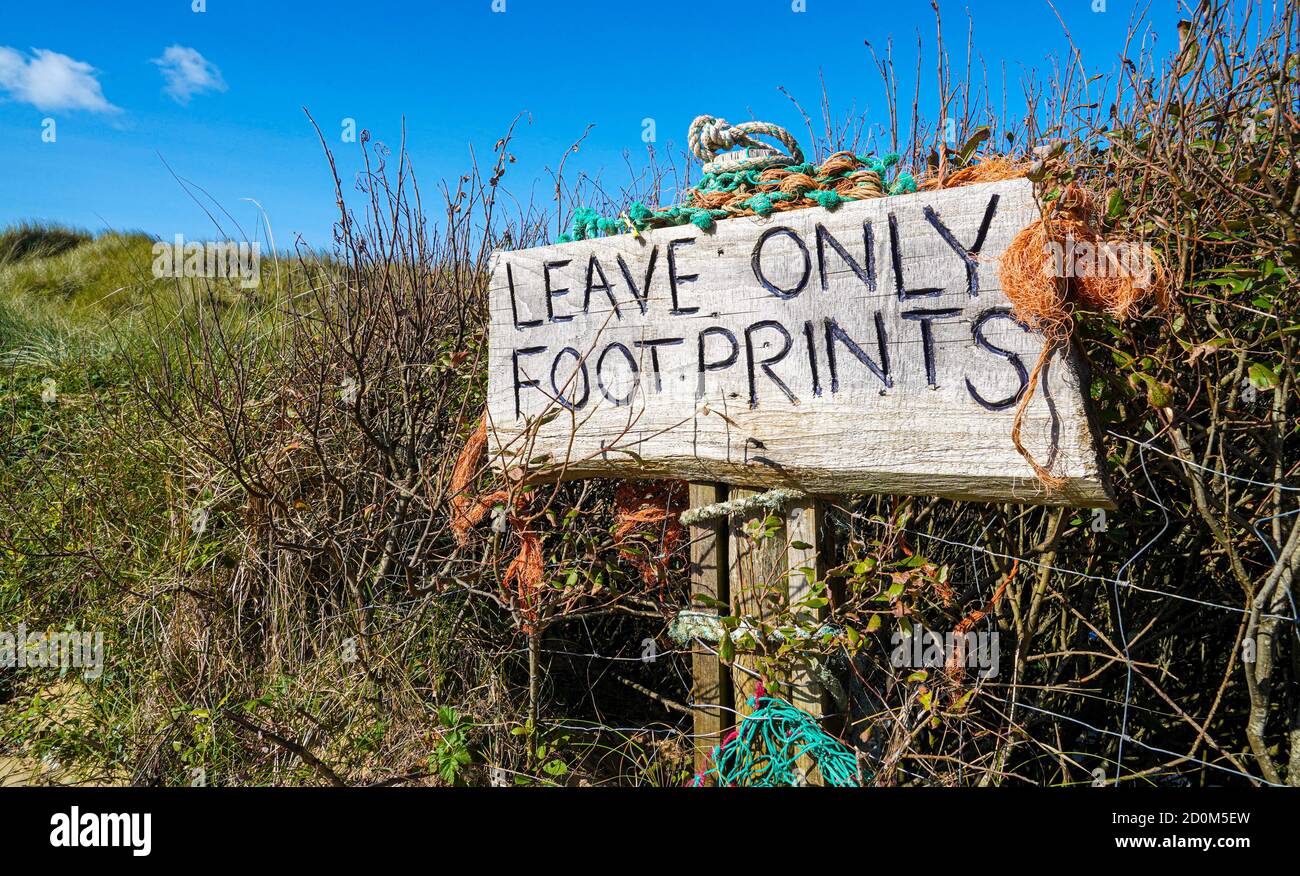 Old Wooden Beach sign enviromental message Leave only Footprints Stock ...
