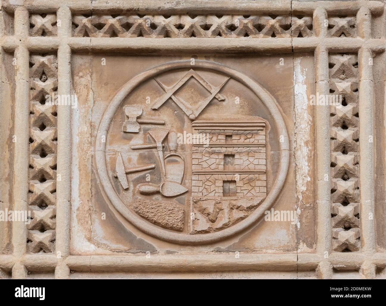 Masonic symbols on a stone mason lodge/house in Spain Stock Photo - Alamy