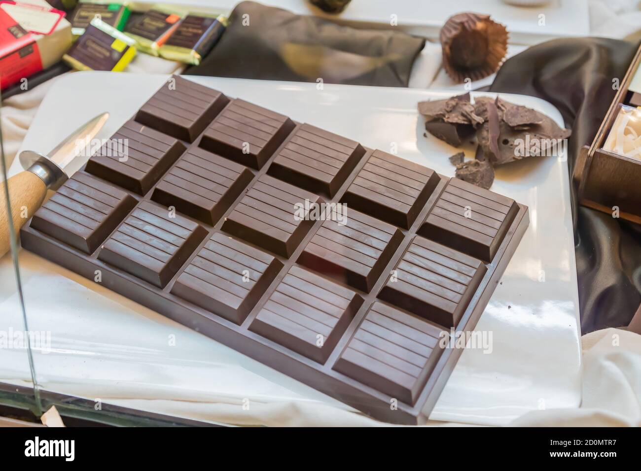 Chocolate bar on the window shop. chocolate shop Stock Photo - Alamy