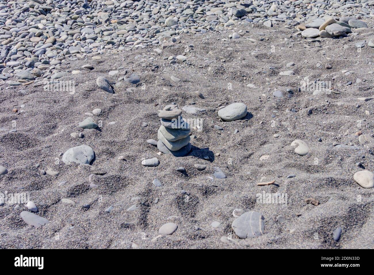 stones on sand. Sea beach. Background Stock Photo - Alamy