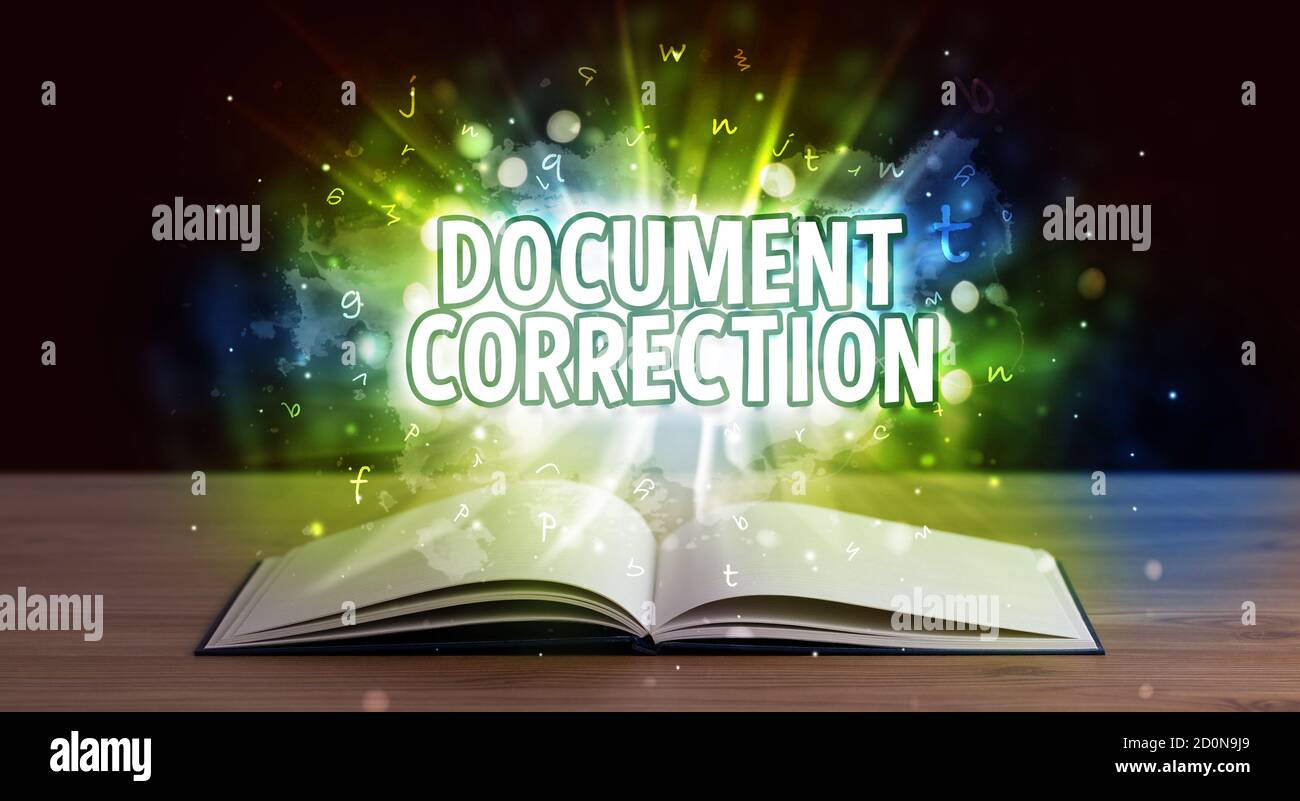 DOCUMENT CORRECTION inscription coming out from an open book ...