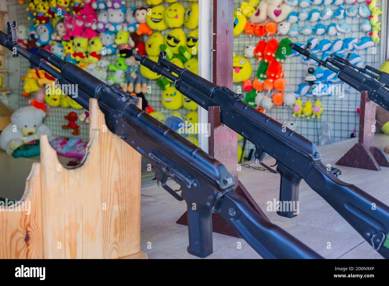 shooting gallery at the fair. Black rifles for target shooting Stock ...