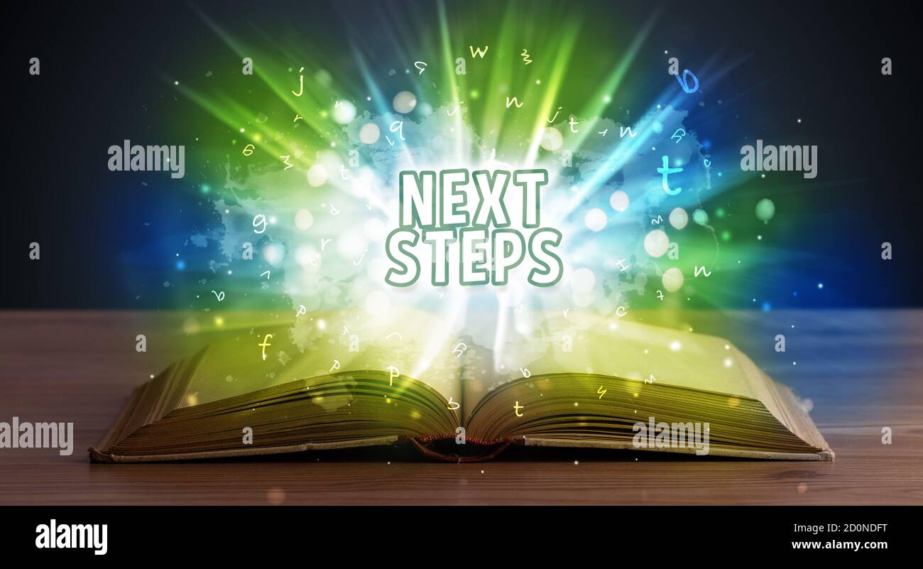 NEXT STEPS inscription coming out from an open book, educational ...