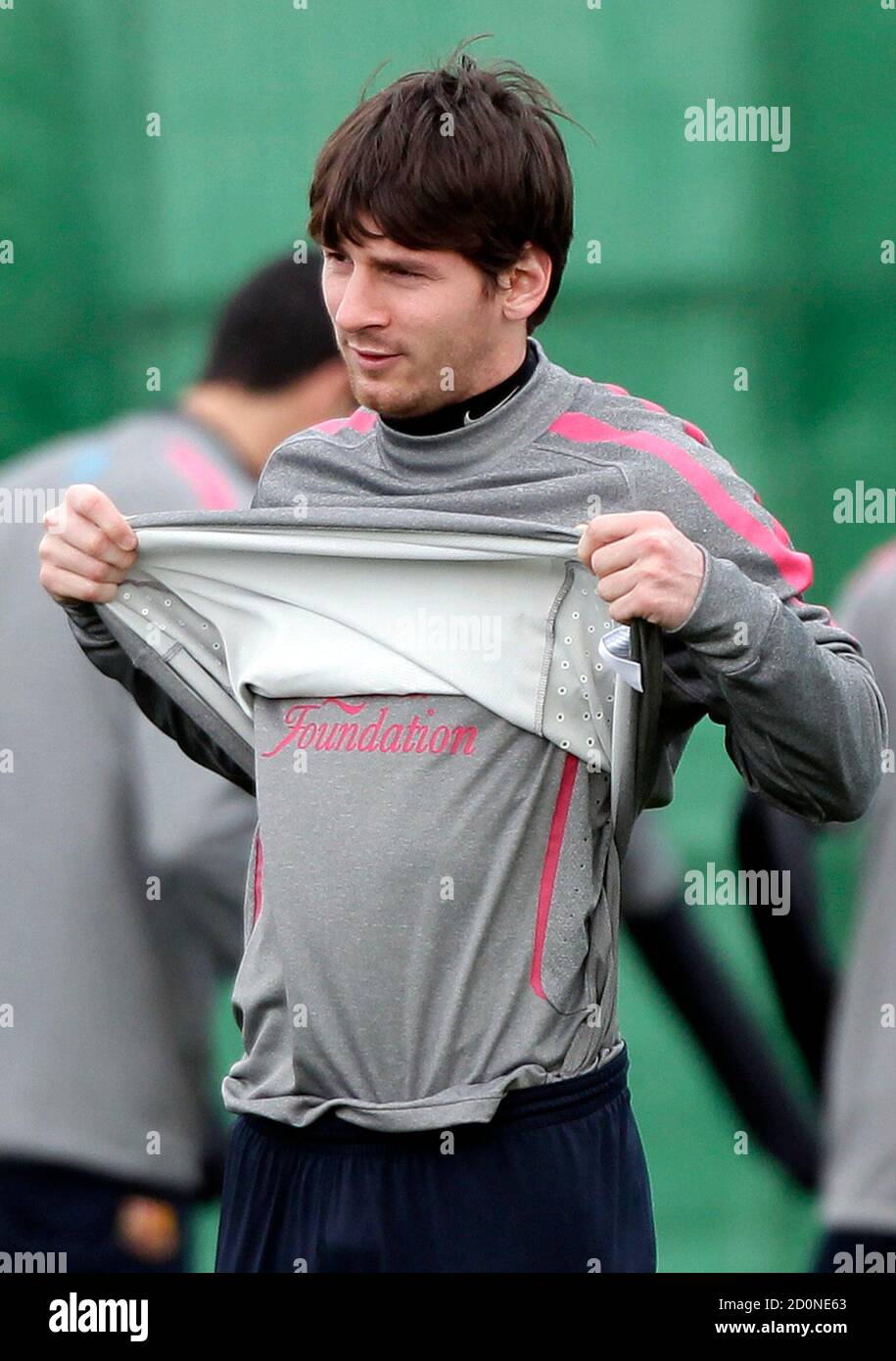 Barcelonas lionel messi attends training hi-res stock photography and ...
