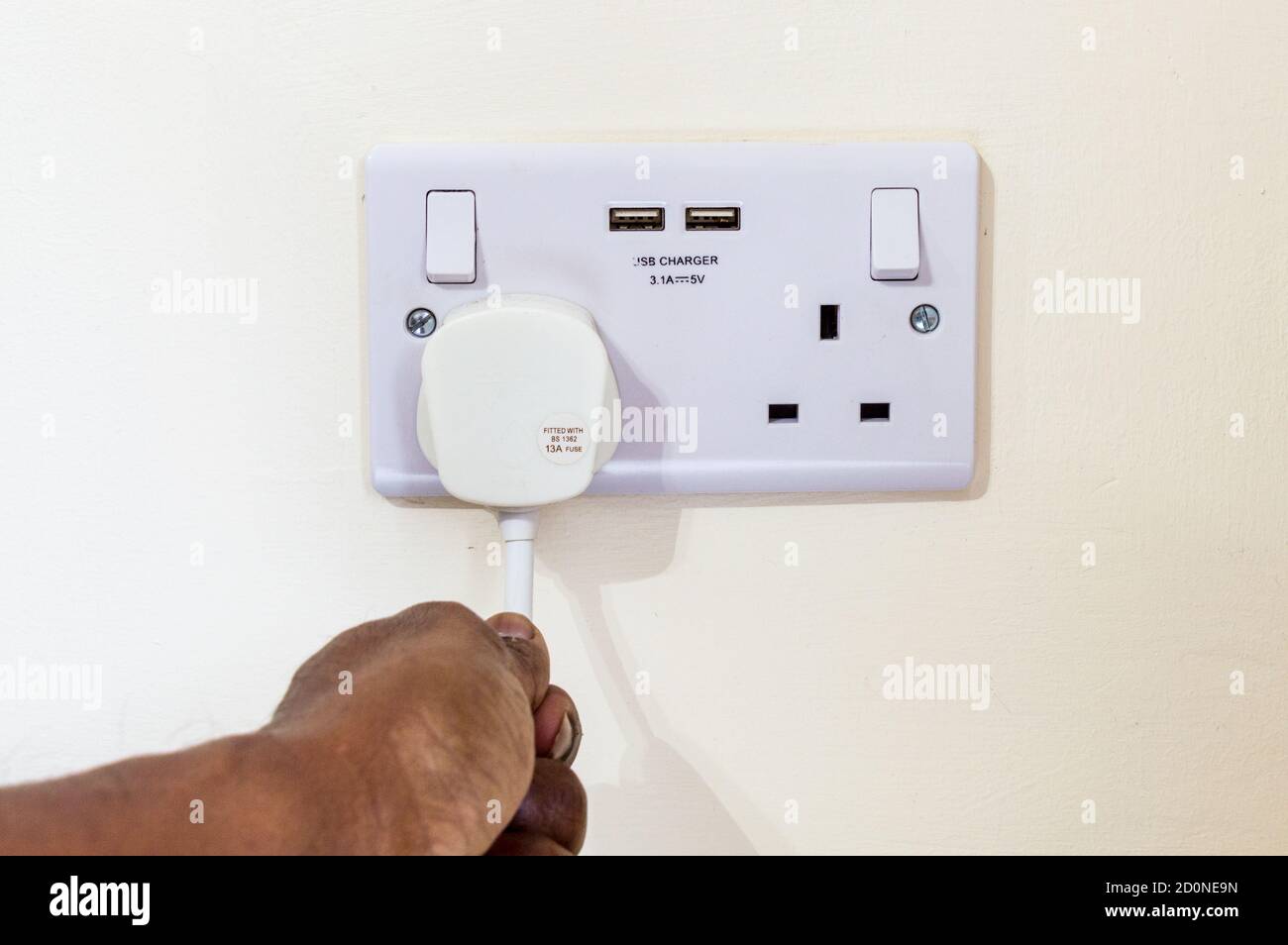 Pull the plug concept of a Man's hand pulling out the plug from a ...