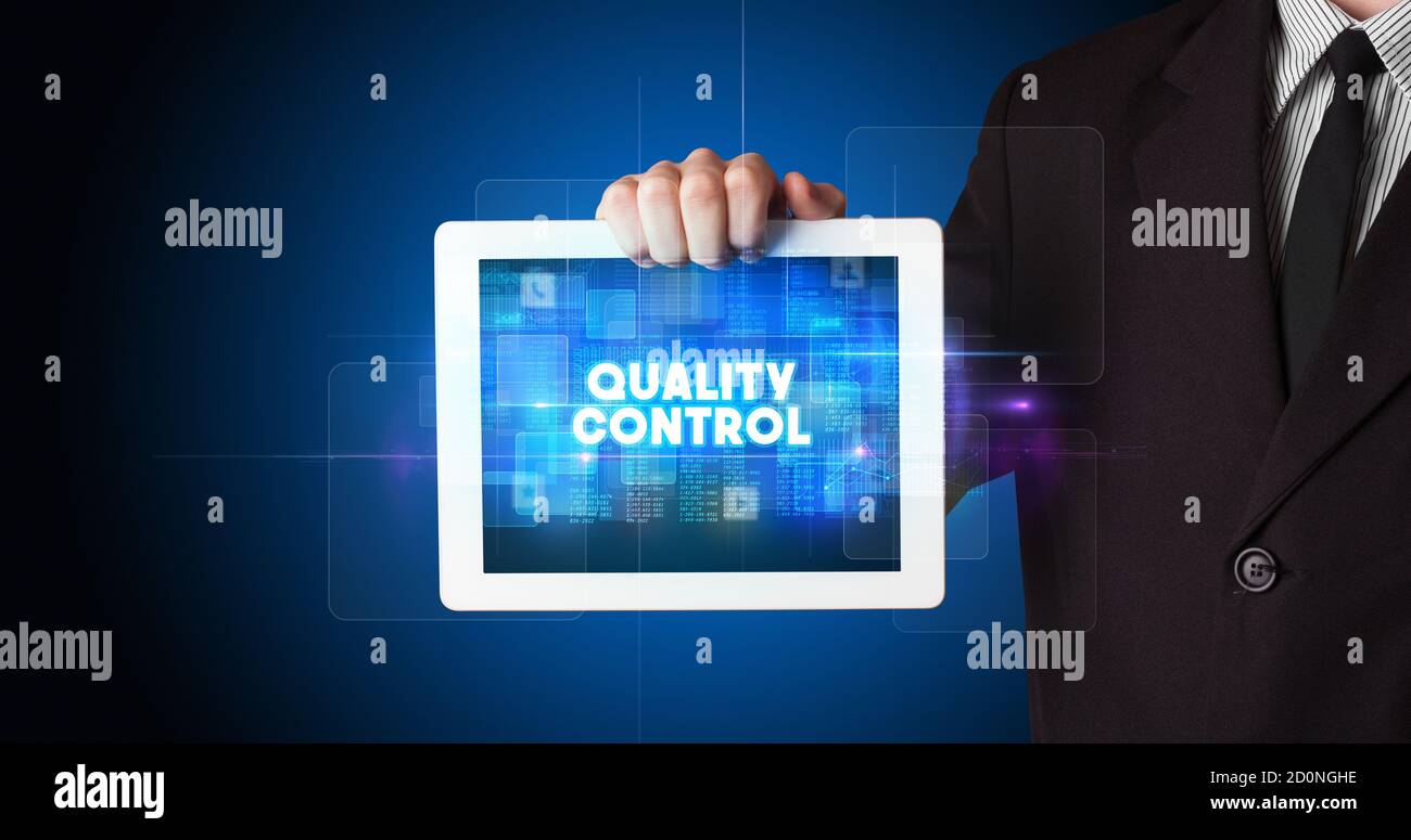 Young business person working on tablet and shows the inscription ...