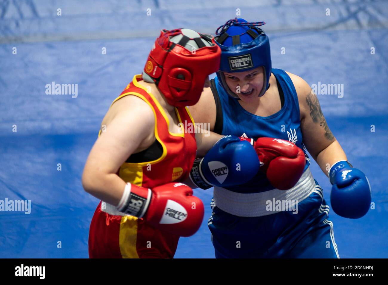 KHARKIV, UKRAINE - OCTOBER 1, 2020: Girls boxers in the fight on the ...