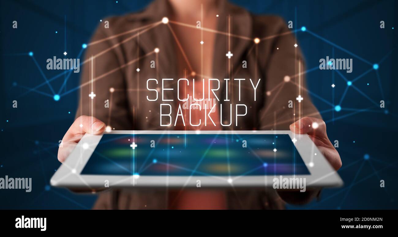 Young business person working on tablet and shows the digital sign ...