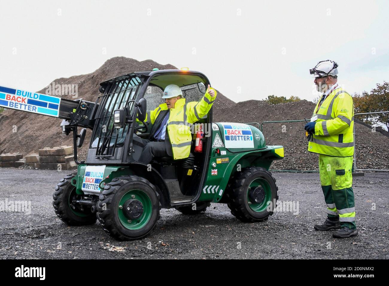 Prime Minister Boris Johnson its in a digger during a visit to the ...