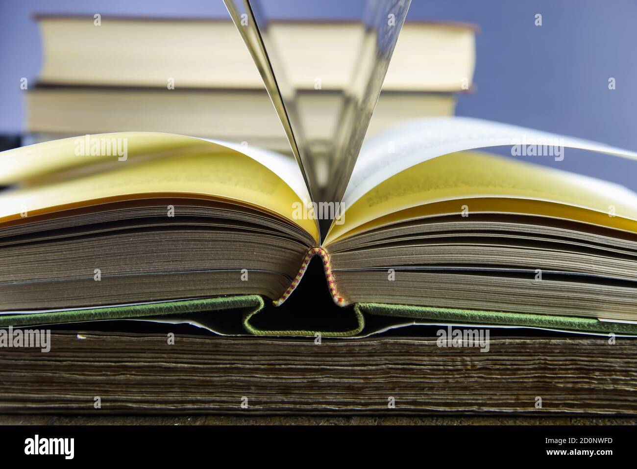 Close up of isolated open book hinge with flying pages, stack of ...