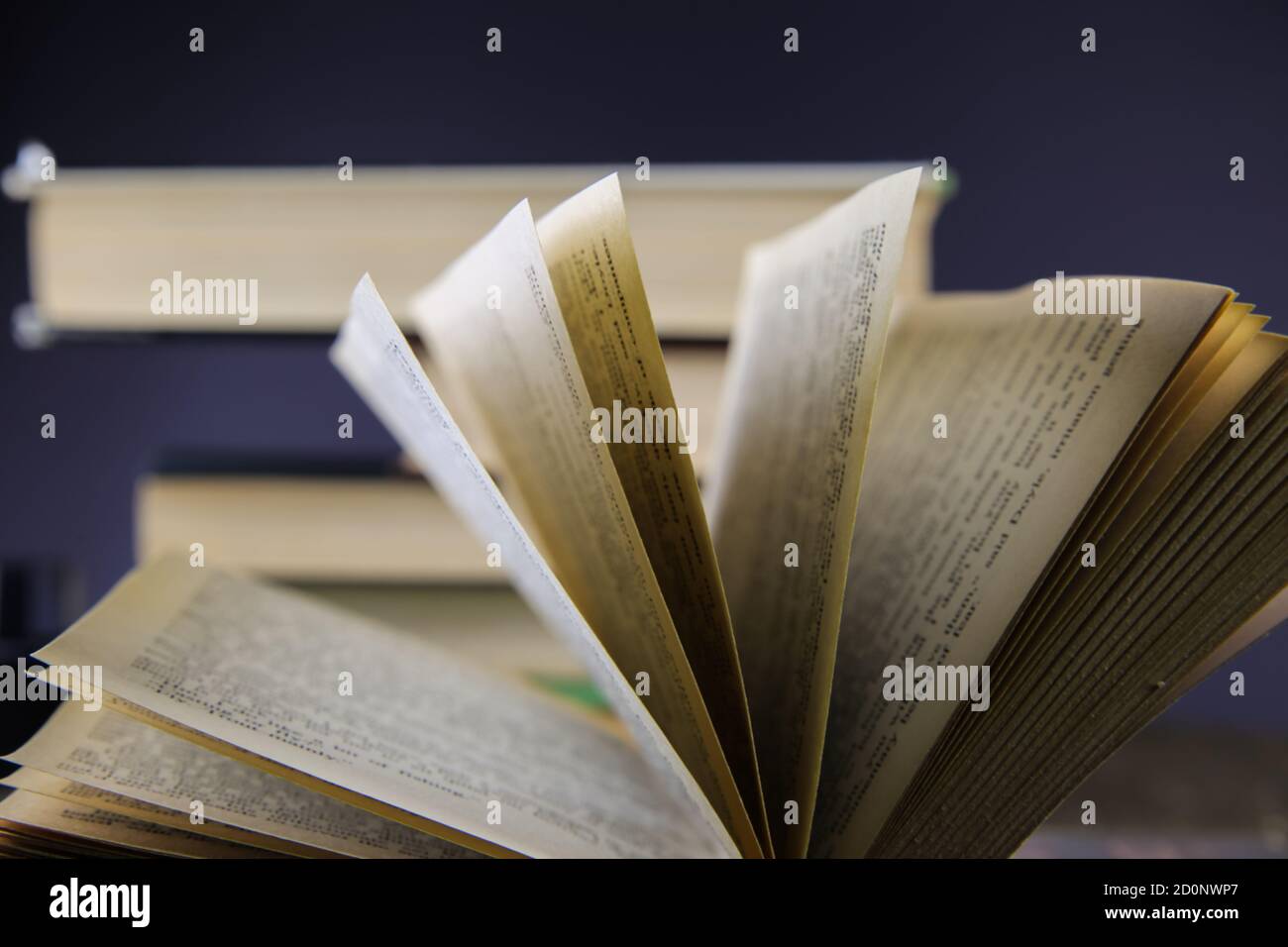 Close up of isolated open book hinge with flying pages, stack of ...