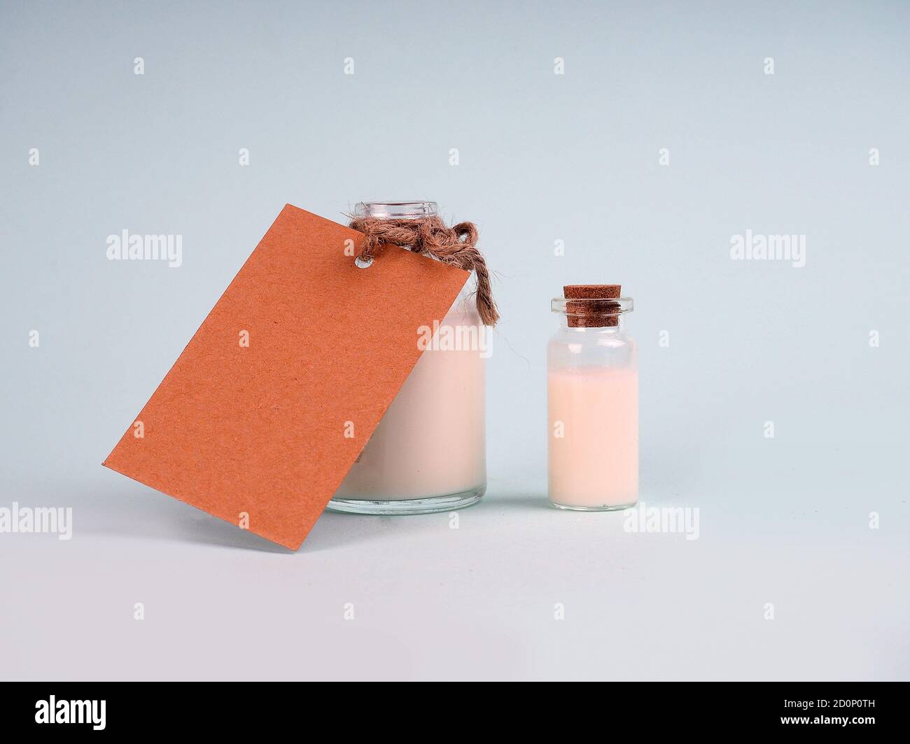 a small bottle of milk sample in a test tube with a label for your text ...