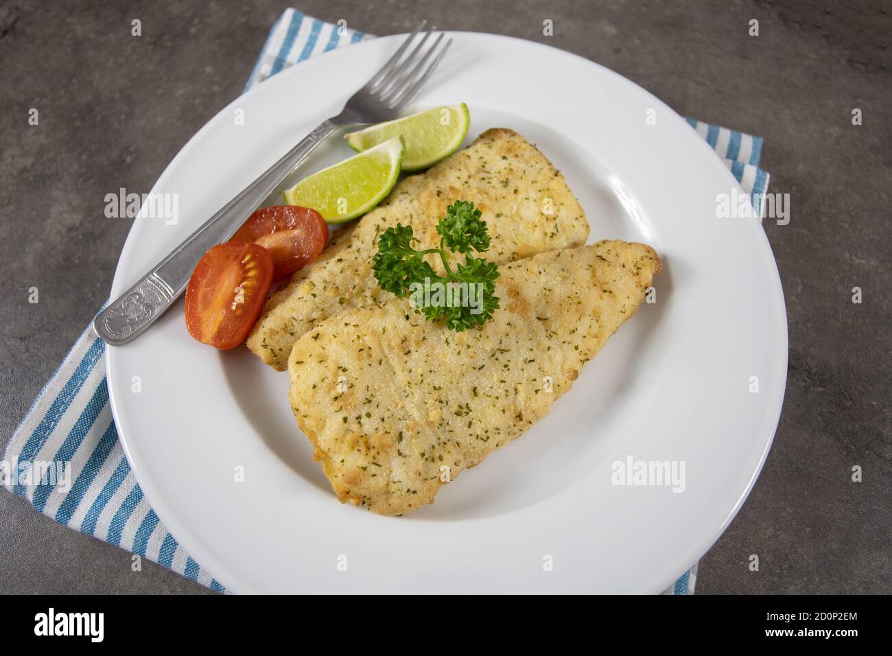 Meunière fish fillet cooked on a plate Stock Photo - Alamy