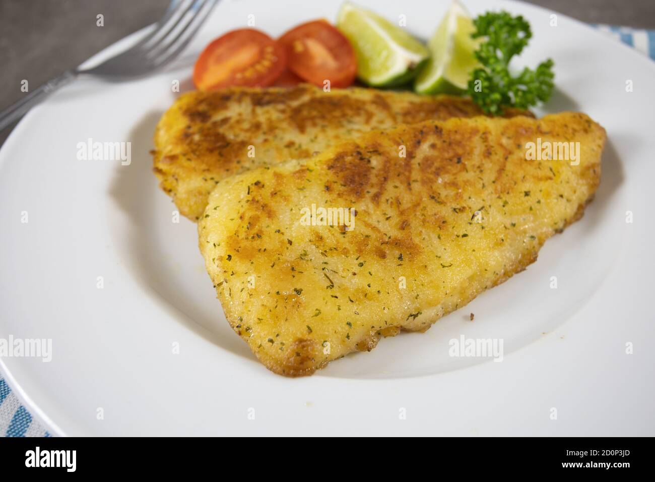 Meunière fish fillet cooked on a plate Stock Photo - Alamy